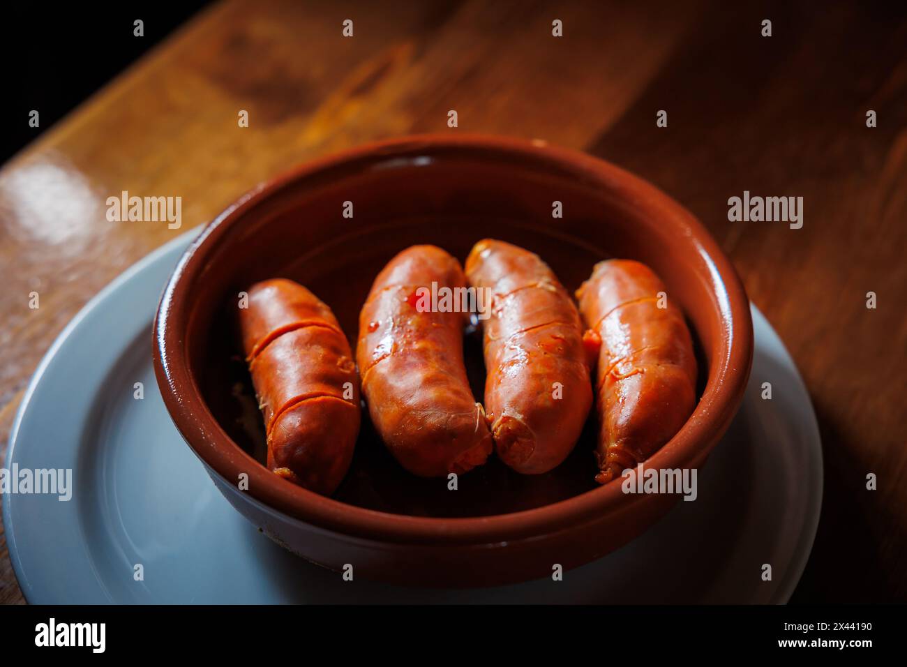 ready to eat fried chorizo plate tapa with bread Stock Photo - Alamy