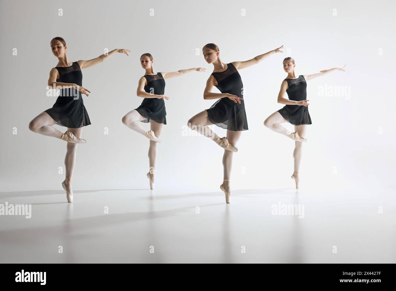 Dance in harmony. Beautiful teen girls, ballerinas in black leotards ...