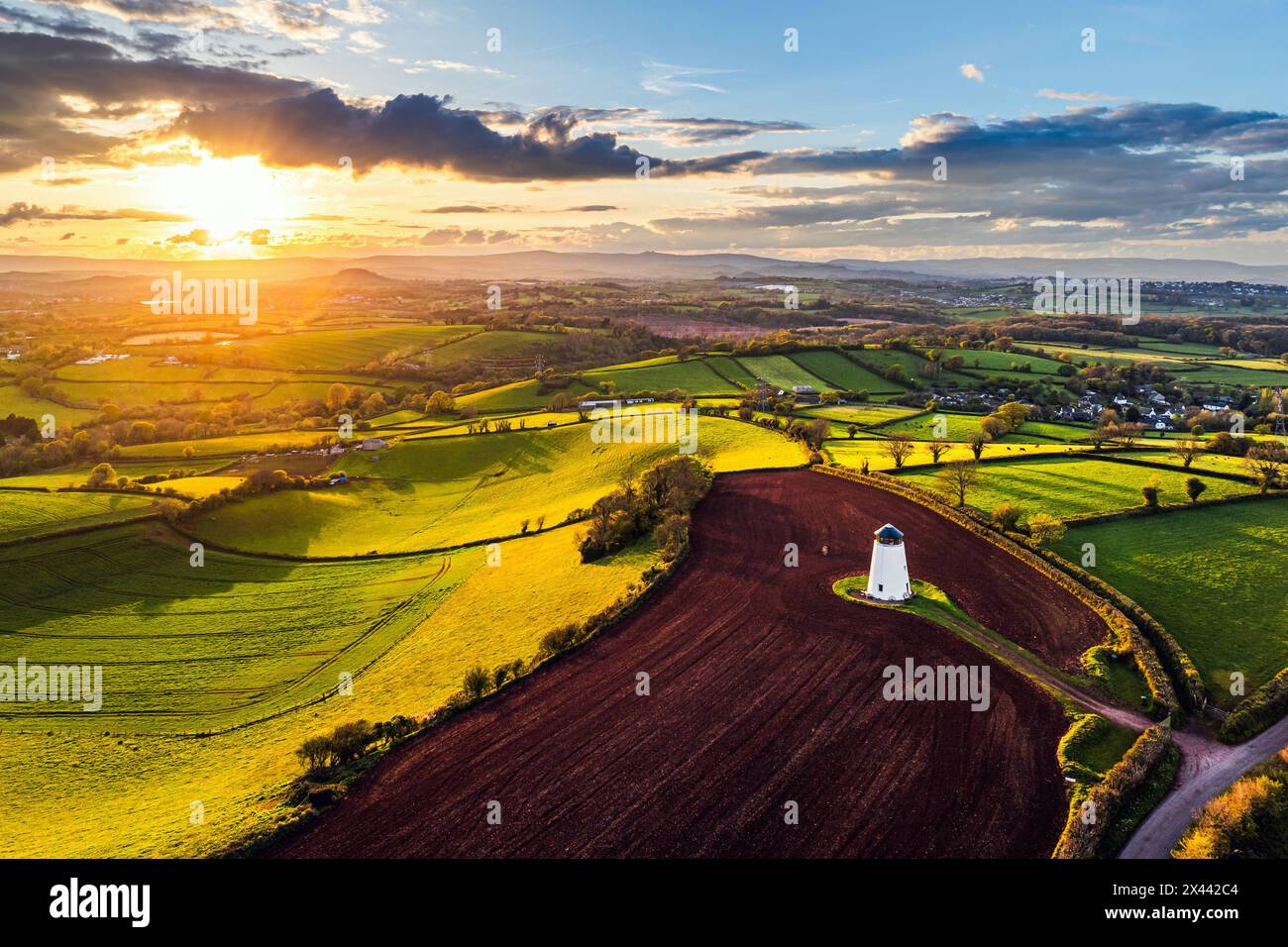 Sunset of Devon Windmill over fields and farms from a drone, Torquay ...