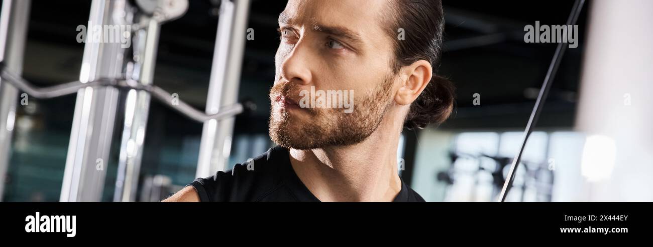 An athletic man in a black tank top is pushing his limits while ...