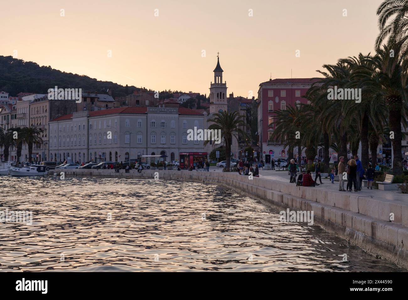 Split, Croatia - April 16 2019: Sunset on the port with the church and ...