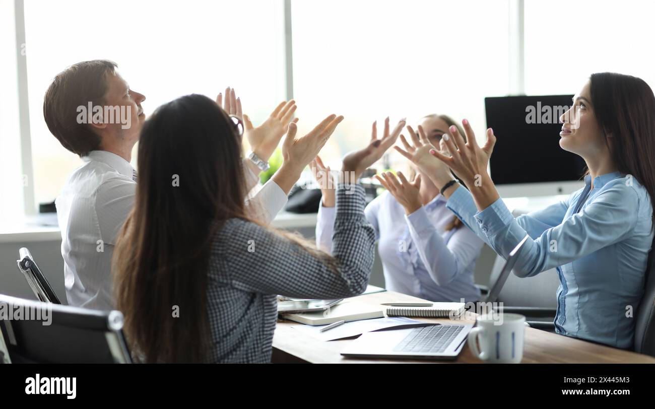 Team of business people raise hand from office background Stock Photo ...