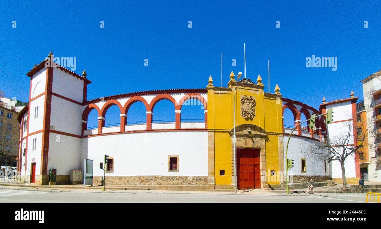 Bright historic building with red accents and coat of arms under a ...
