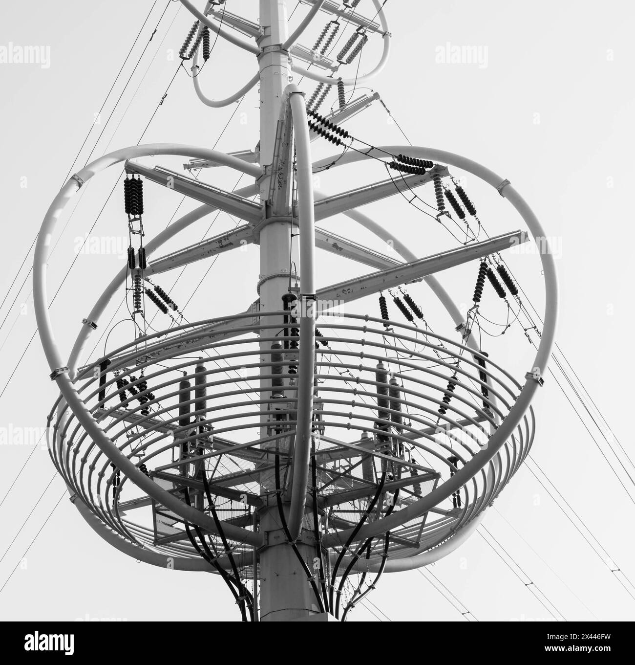 Black and white closeup of large, round, cable transition tower with ...