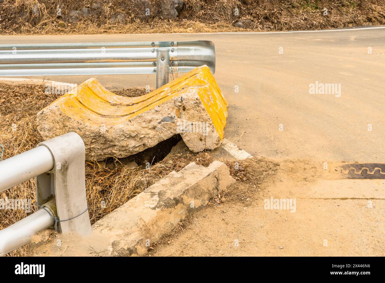 End buttress of street curb broken off and laying on ground at ...
