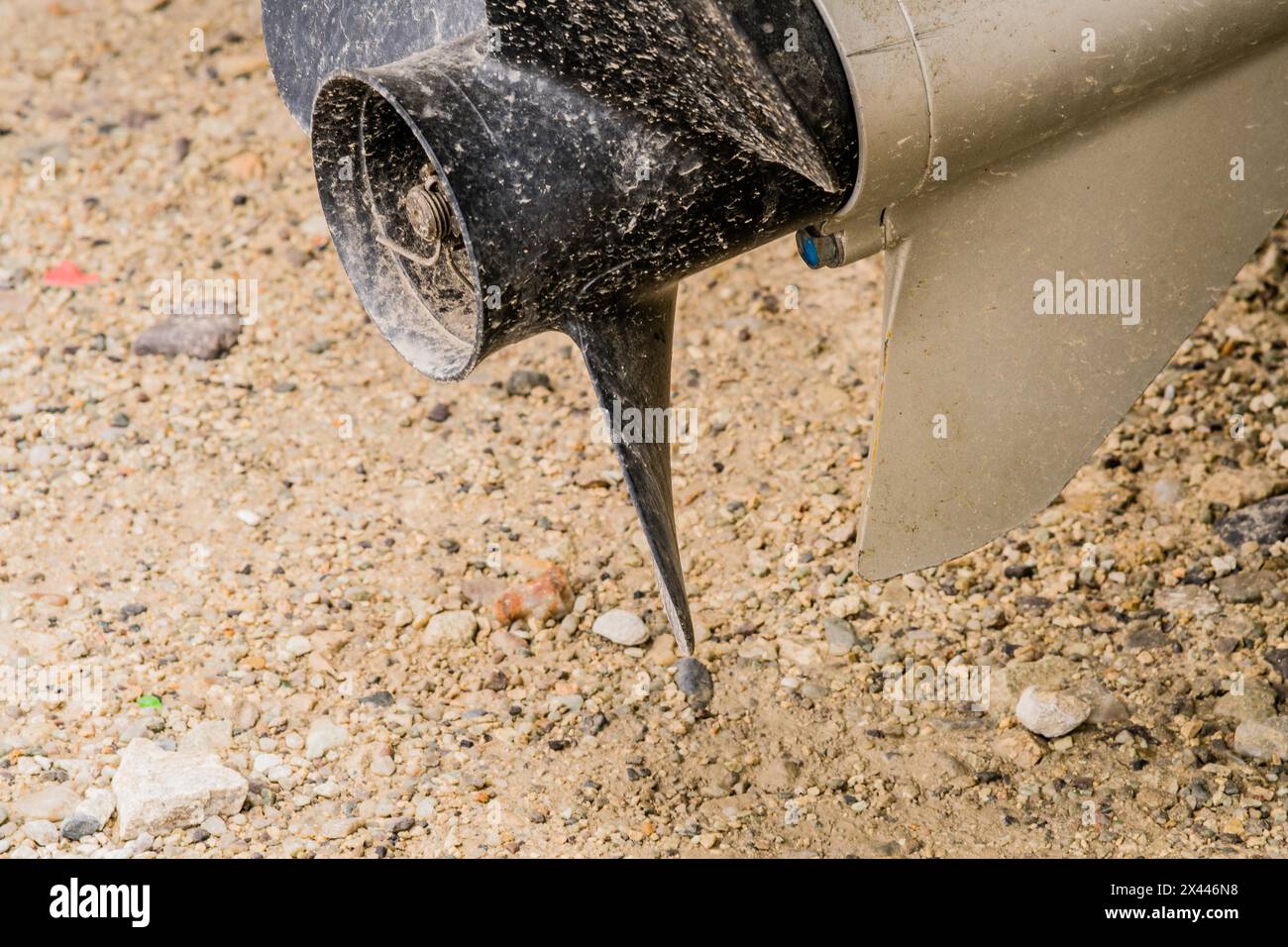 Closeup of black propeller and rudder shaft of outboard engine used to ...