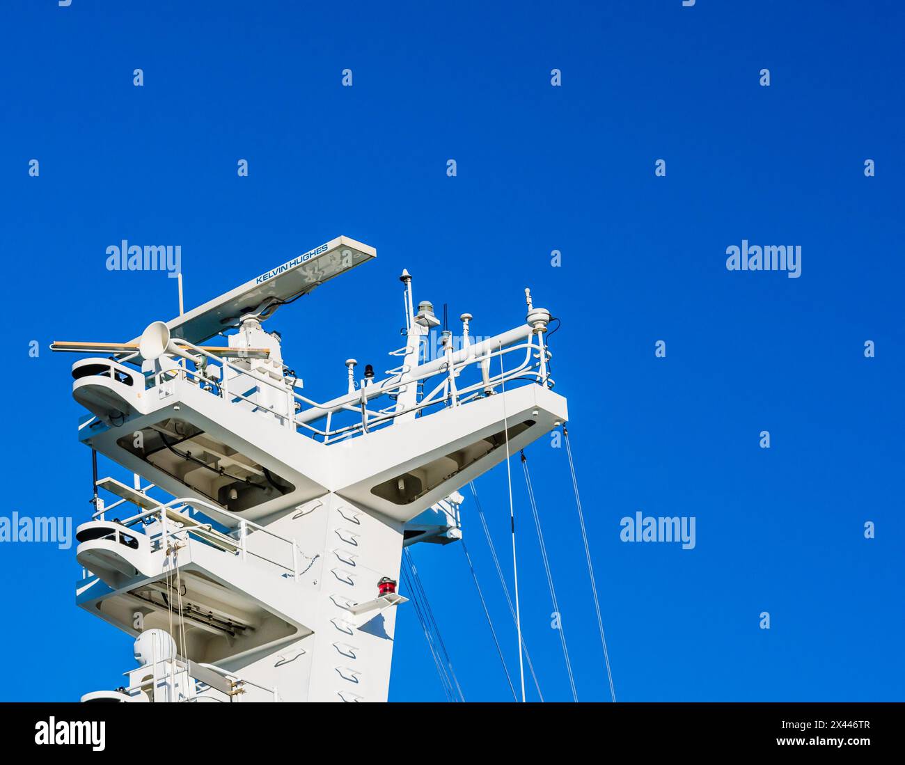 Radar assembly on mast of a coast guard frigate with the word Kelvin ...