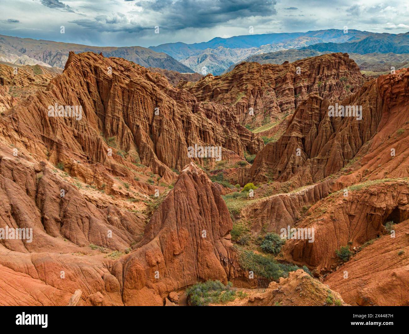 Badlands, canyon with eroded red sandstone rocks, Konorchek Canyon ...