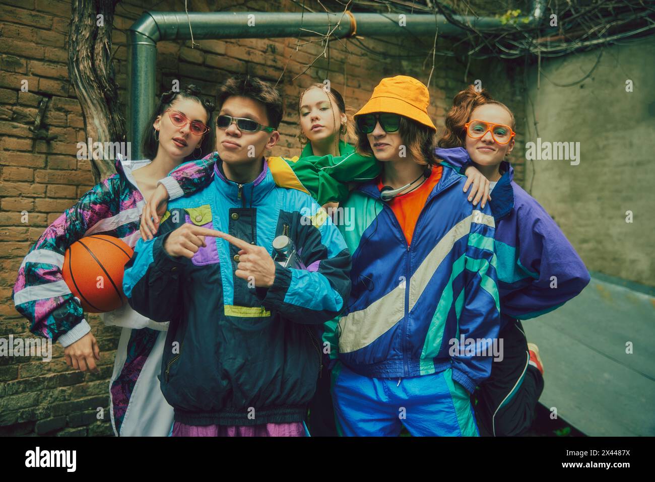 Youthful spirit of street fashion. Stylish young people, boys and girls ...