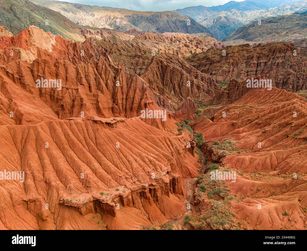 Badlands, canyon with eroded red sandstone rocks, Konorchek Canyon ...