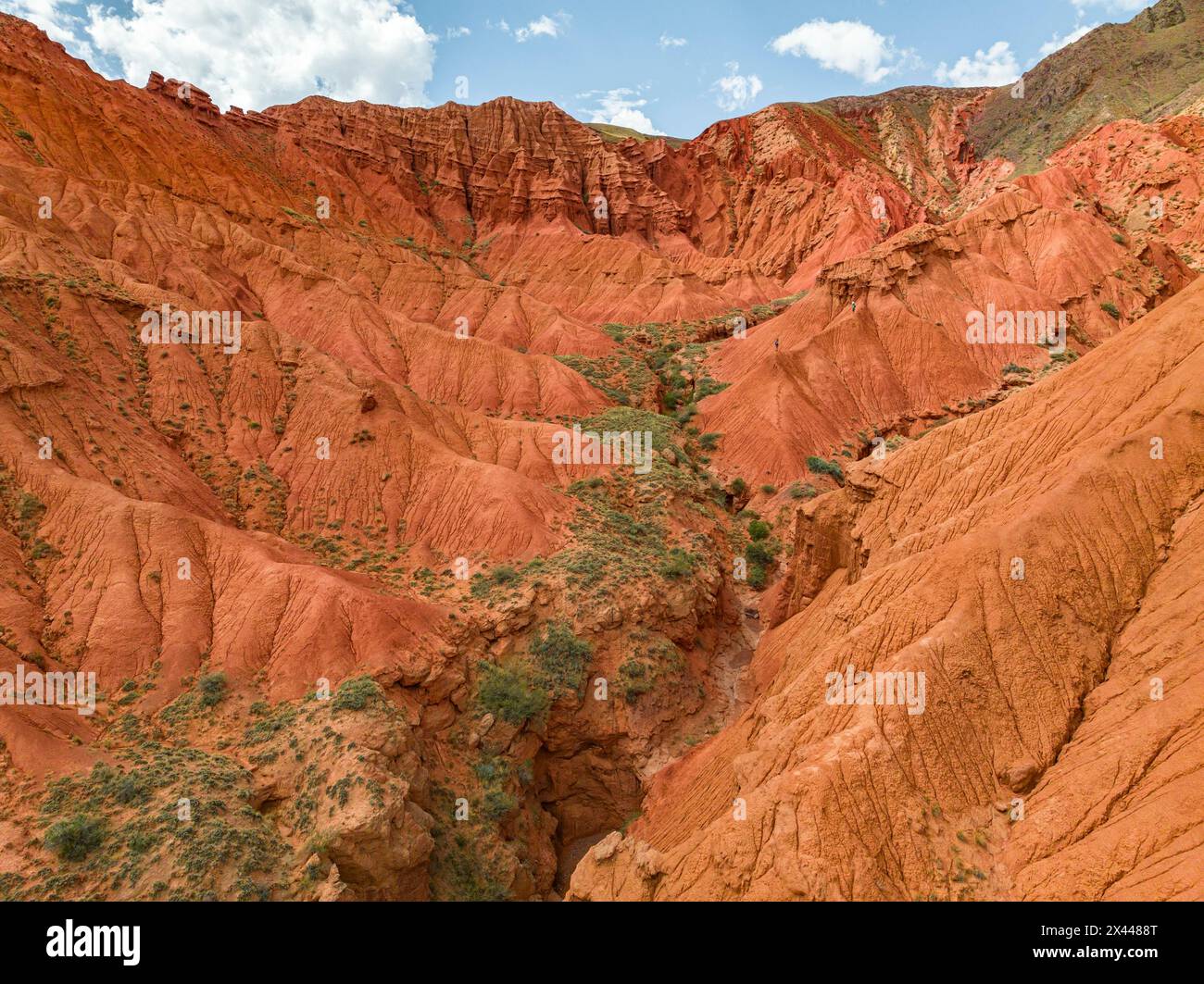 Badlands, canyon with eroded red sandstone rocks, Konorchek Canyon ...