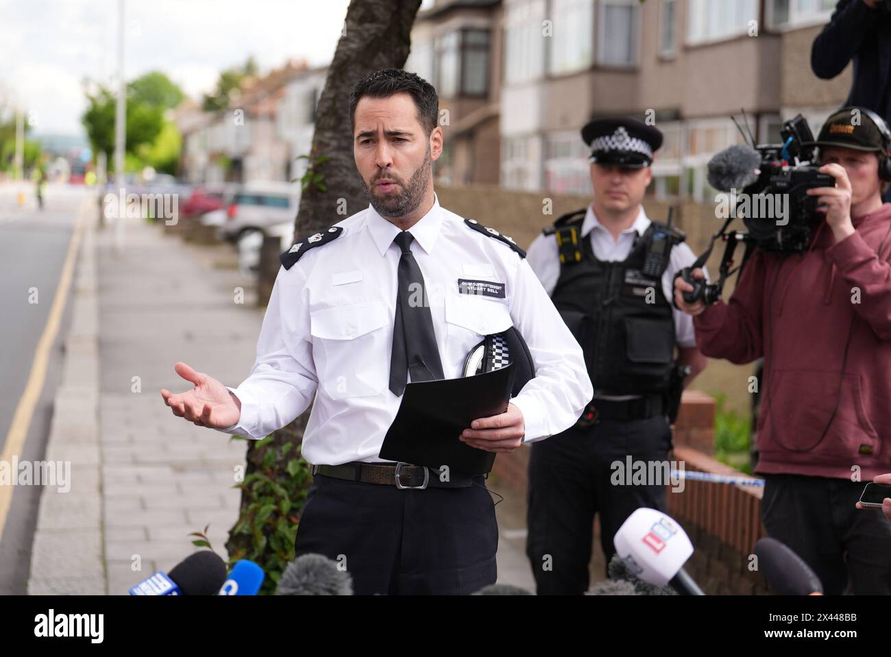 Chief Superintendent Stuart Bell reads a statement to the media near ...