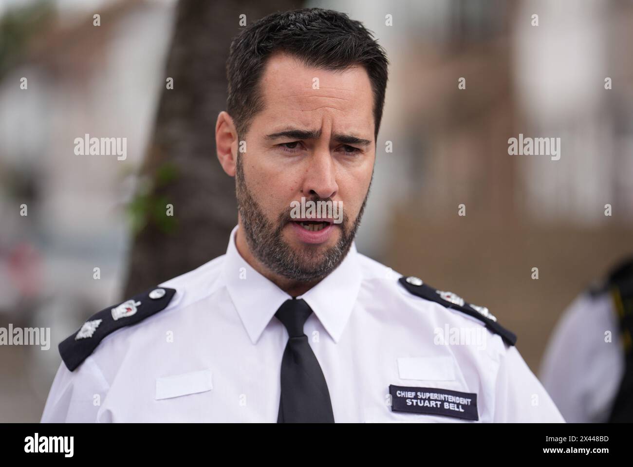 Chief Superintendent Stuart Bell reads a statement to the media near ...