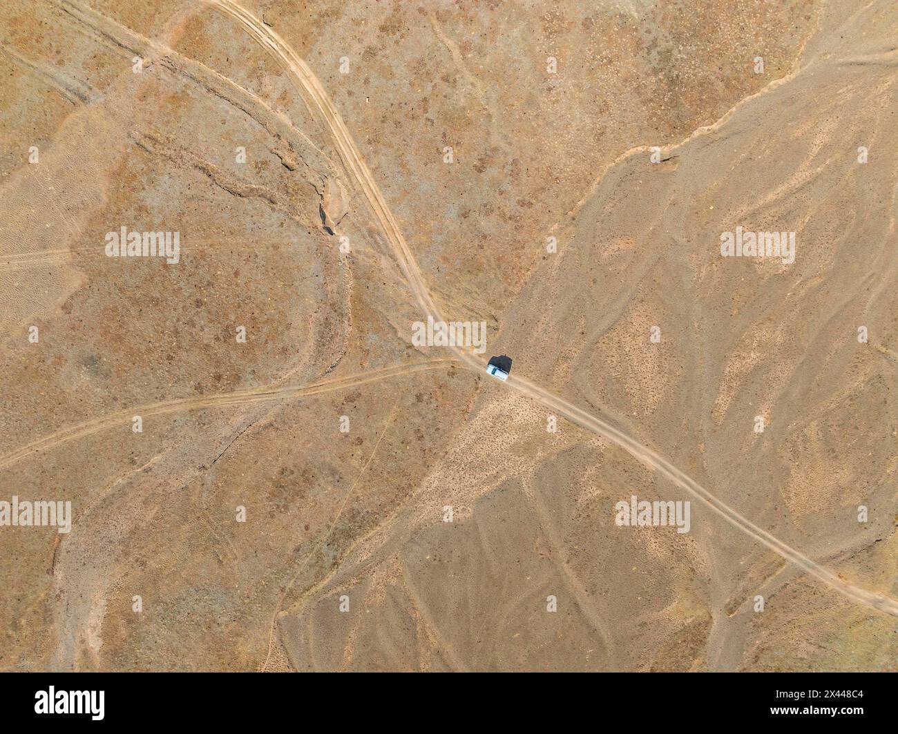 Aerial view, Vast empty landscape, Road and off-road vehicle, Top down ...