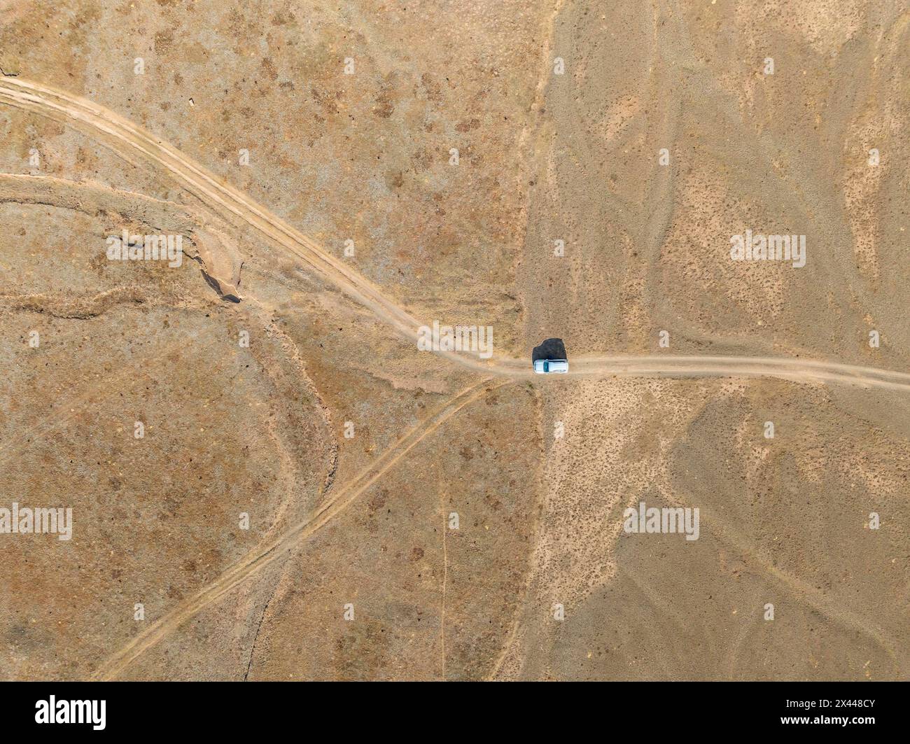 Aerial view, Vast empty landscape, Road and off-road vehicle, Top down ...