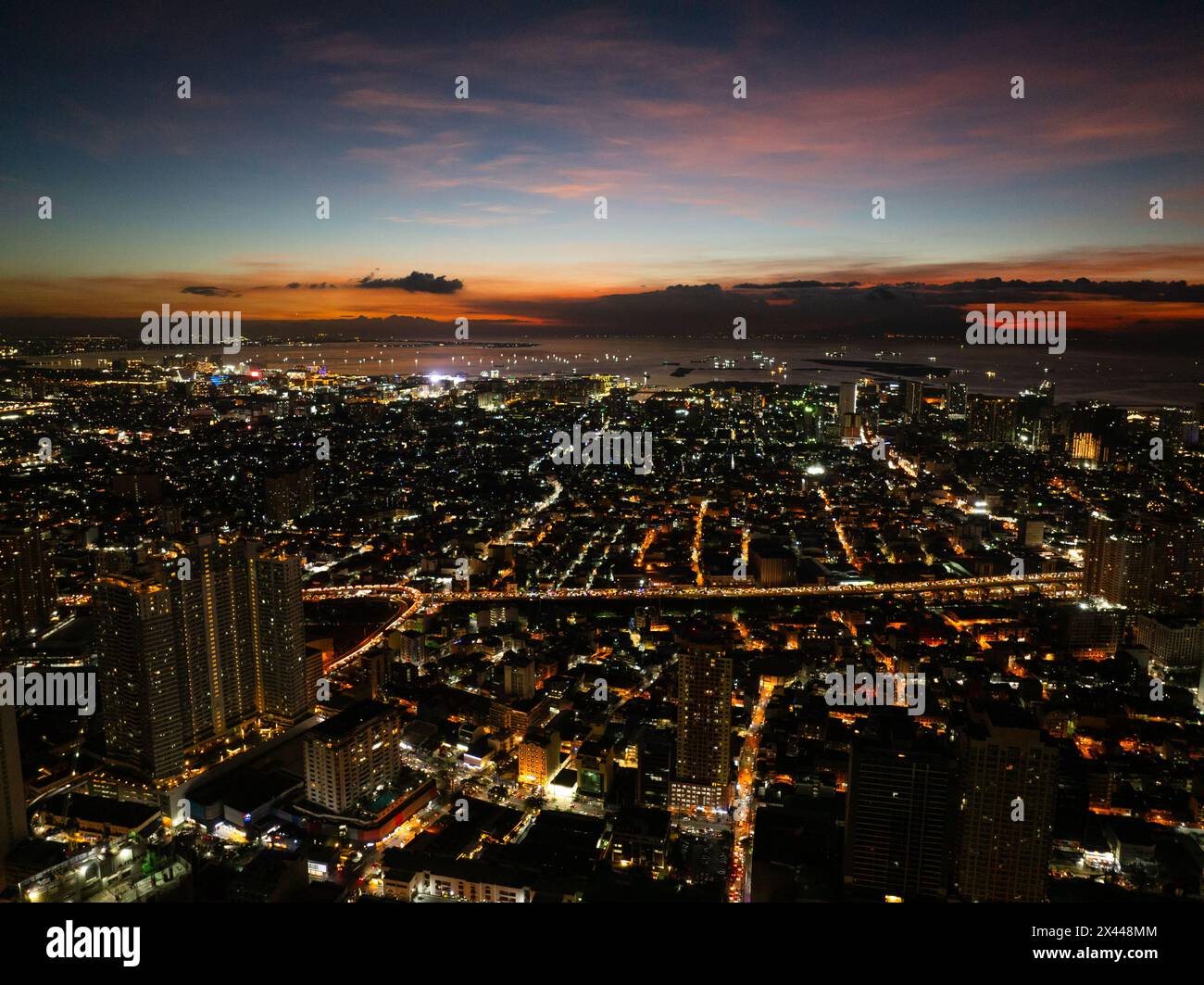 Coastal City at night with colorful busy streets with lights. Makati, Metro Manila. Philippines ...