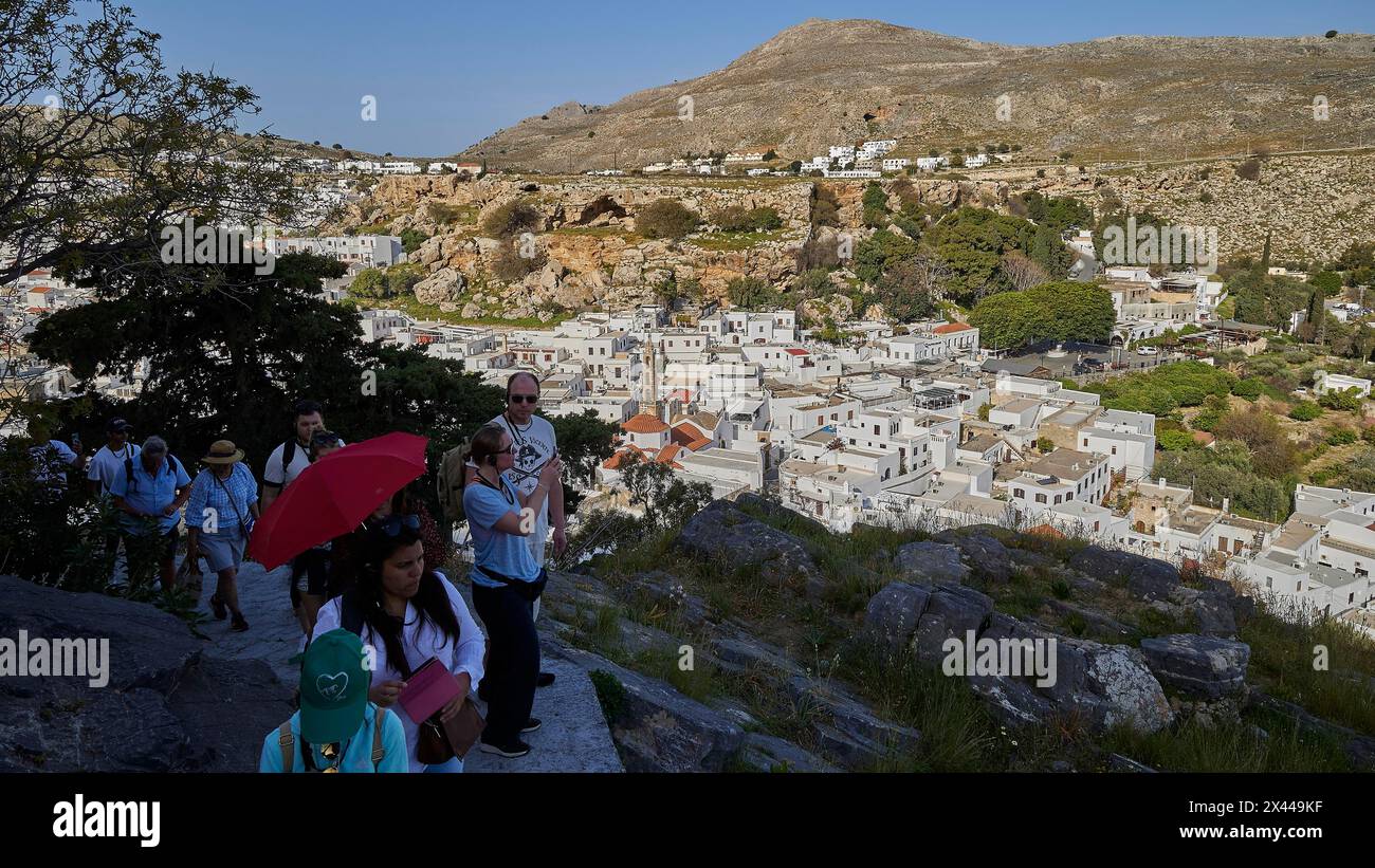 Way to the Acropolis, tourists walking on a path near a traditional ...