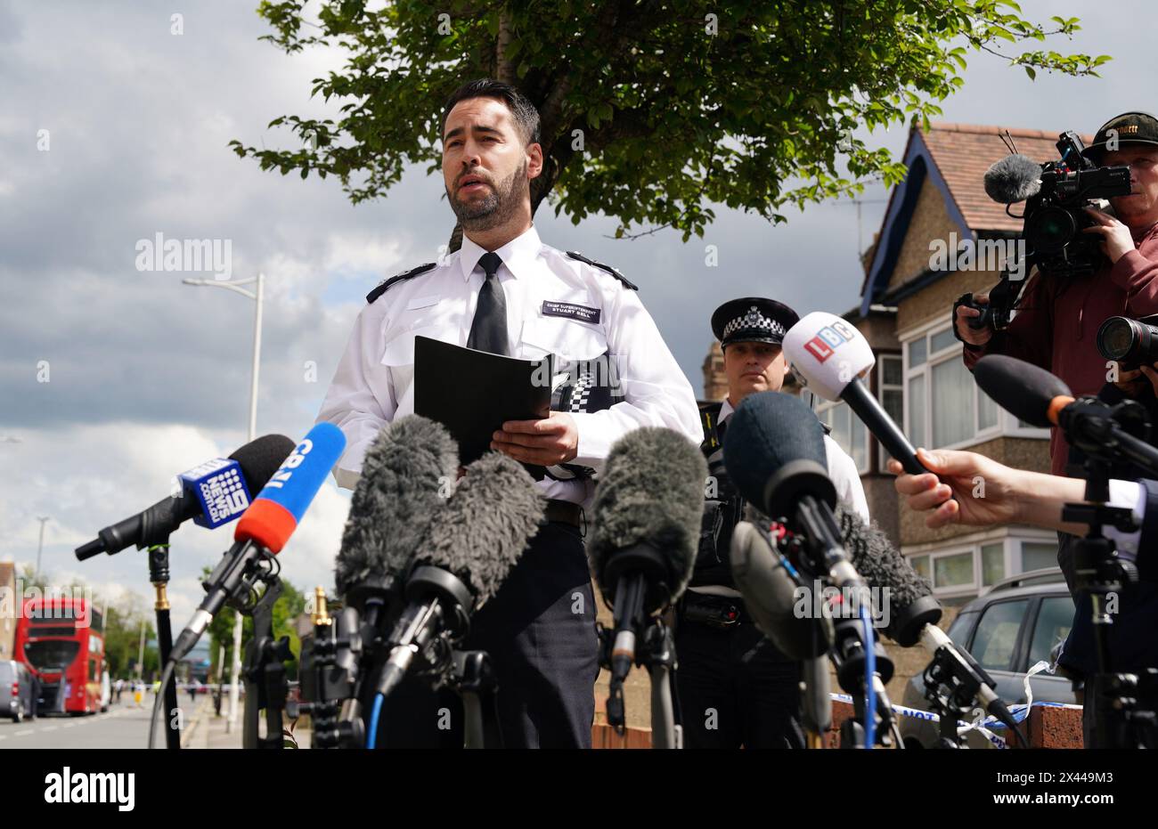 Chief Superintendent Stuart Bell reads a statement to the media near ...