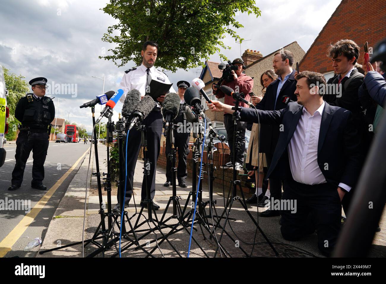 Chief Superintendent Stuart Bell reads a statement to the media near ...