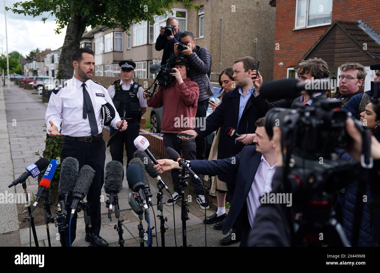 Chief Superintendent Stuart Bell reads a statement to the media near ...