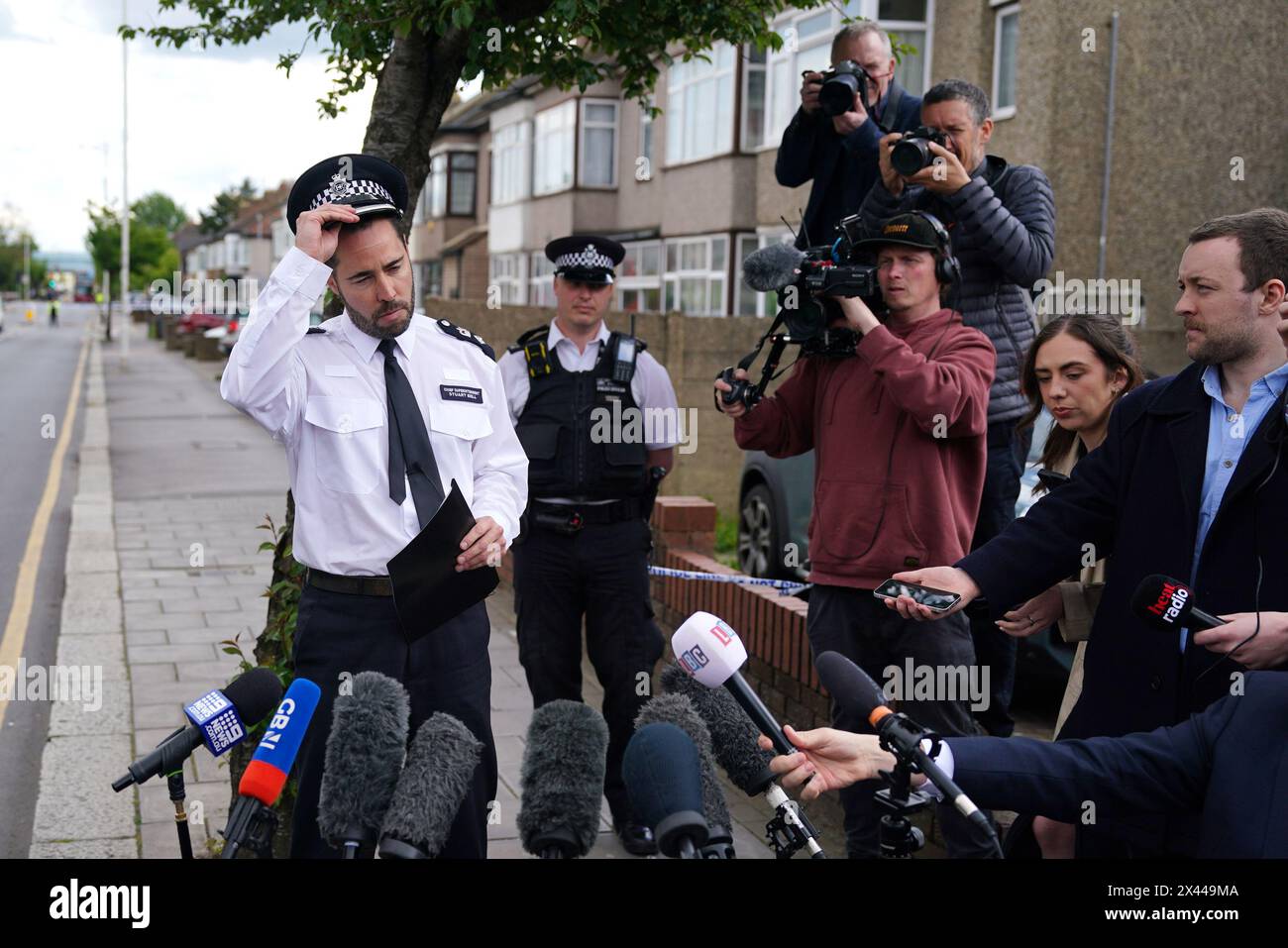 Chief Superintendent Stuart Bell reads a statement to the media near ...
