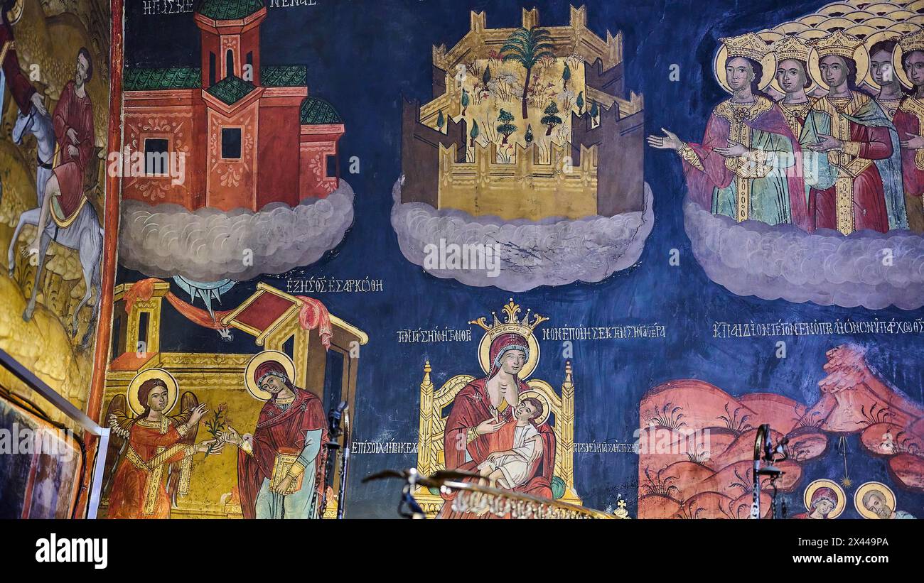 Colourful frescoes depict biblical scenes with saints, angels and ...