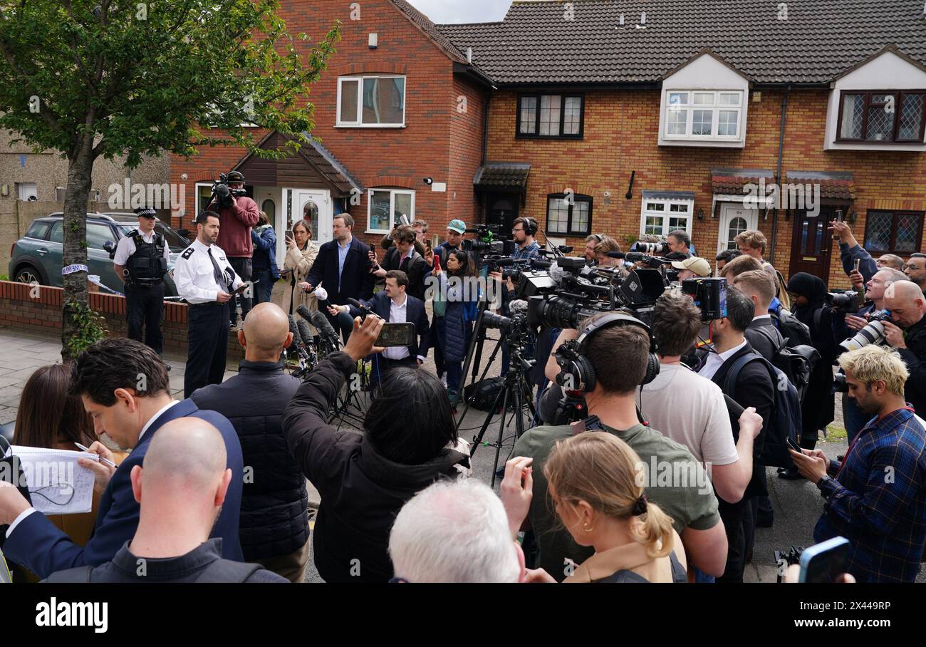 Chief Superintendent Stuart Bell reads a statement to the media near ...