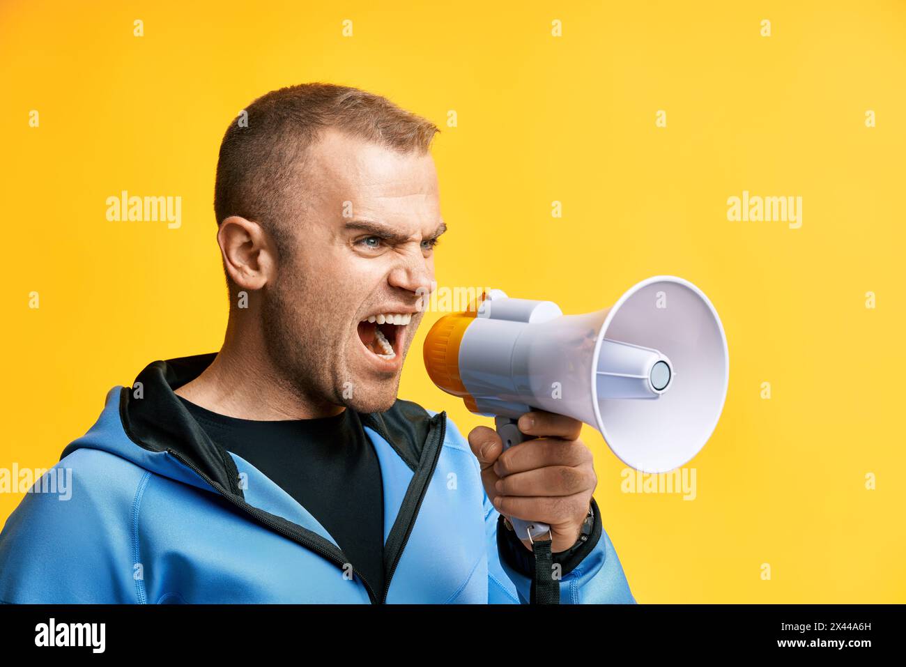 Angry man screaming megaphone hi-res stock photography and images - Alamy