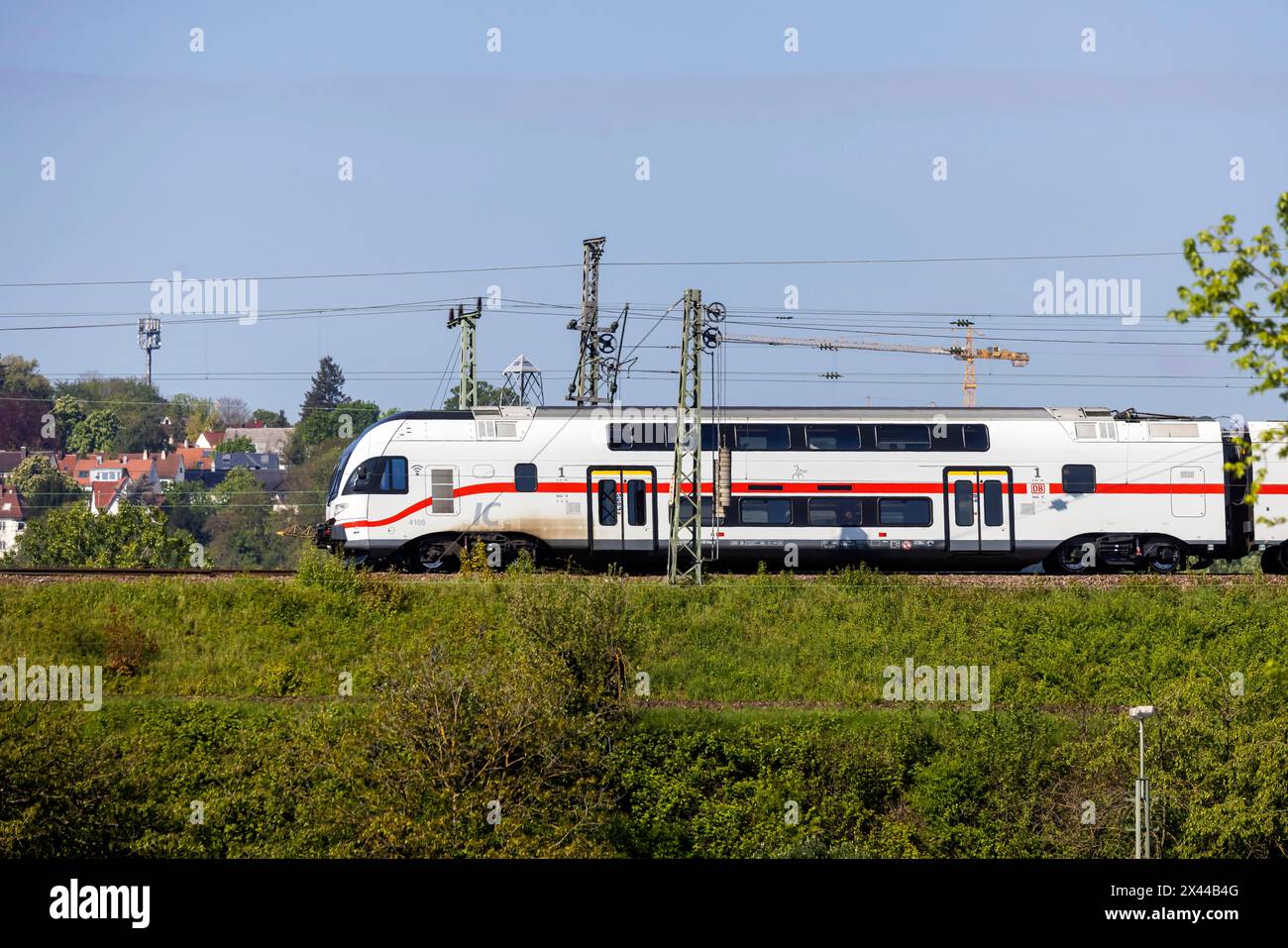 Deutsche Bahn AG InterCity en route, railway embankment and overhead ...