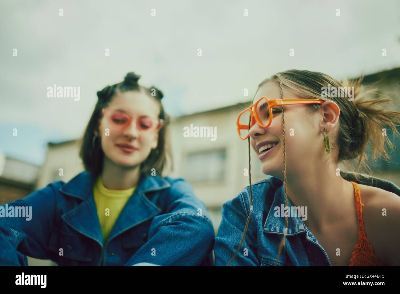 Young people, stylish girls wearing denim clothes and and colorful ...