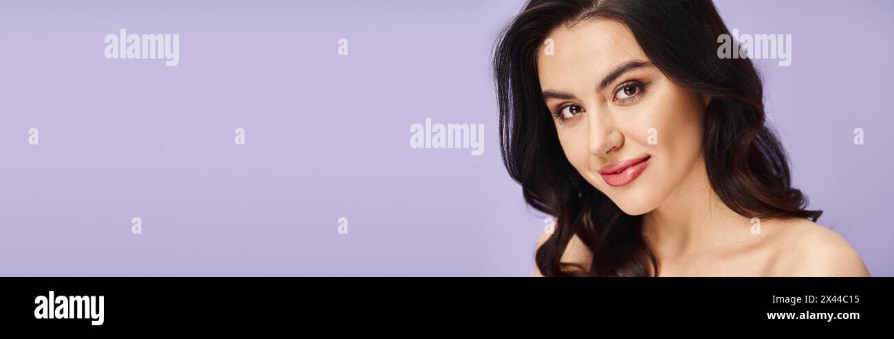 A captivating woman with long black hair striking a pose Stock Photo ...