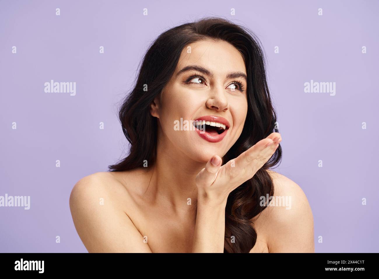 A woman with natural beauty, with makeup, makes funny faces with her ...