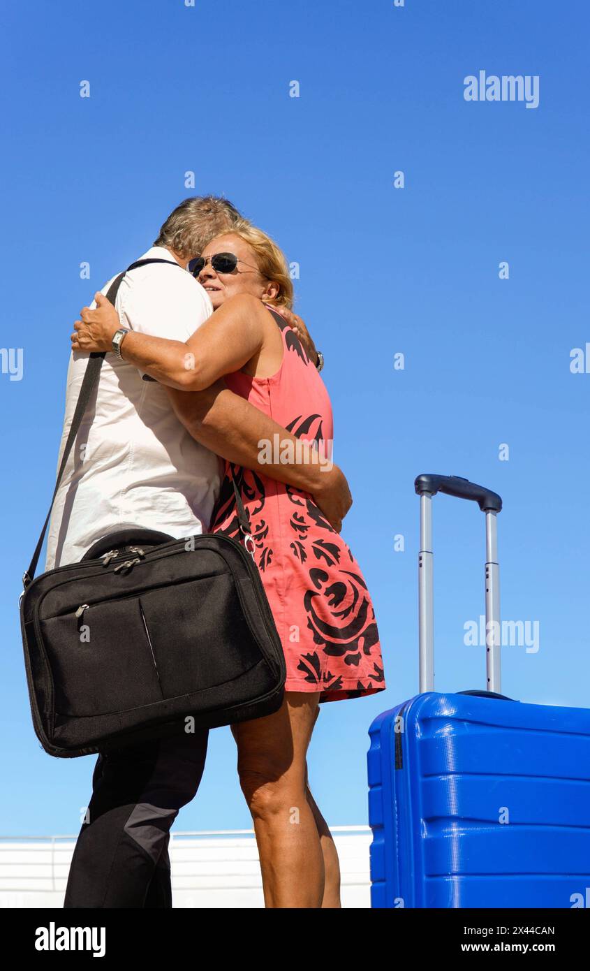 couple of tourists hugging at the arrival of the flight at the airport ...