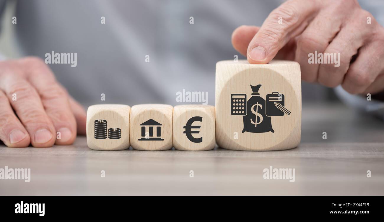 Wooden blocks with symbol of money management concept Stock Photo - Alamy