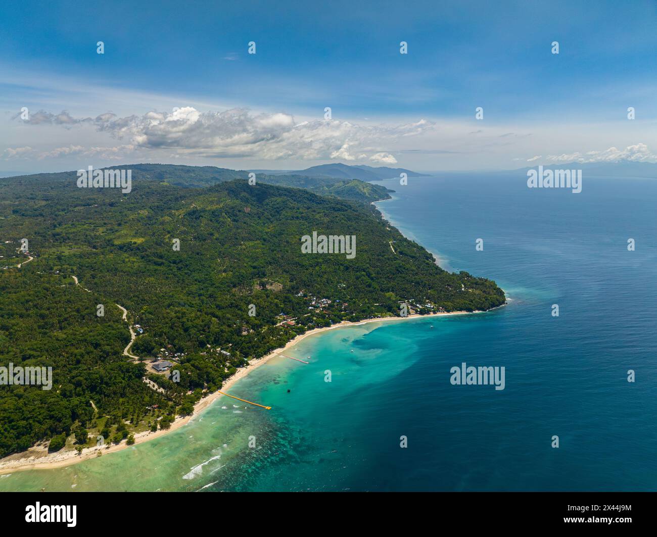 Tropical beach with white sand and trees. Transparent azure water and ...