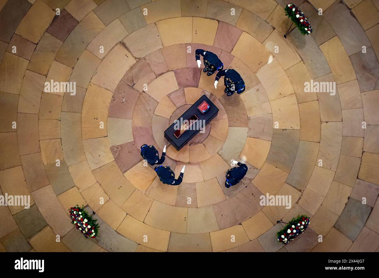 WASHINGTON, DC - APRIL 29: An honor guard salutes an urn containing the ...