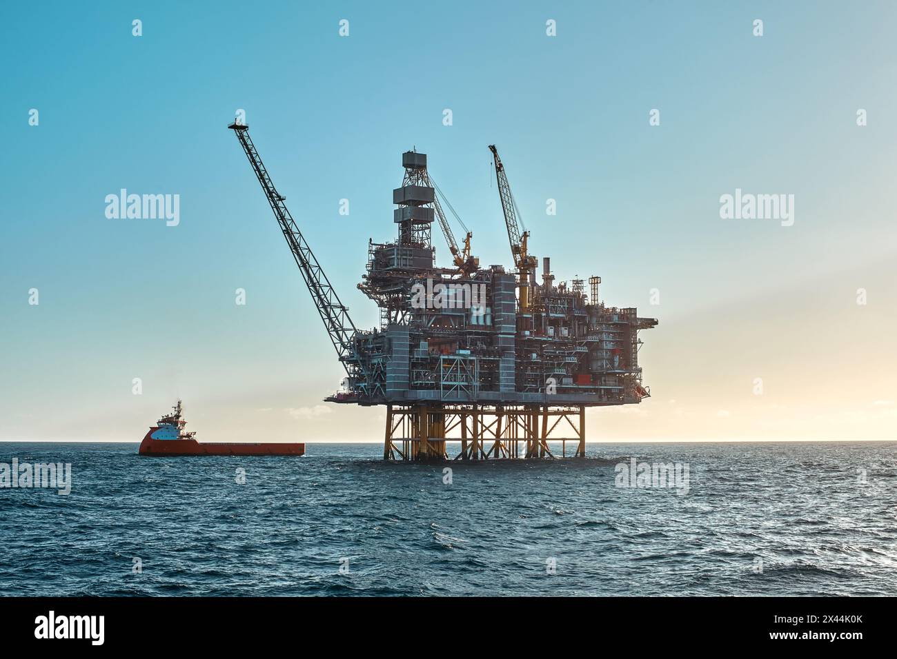 Offshore oil and gas jackup platform, during cargo operations with ...