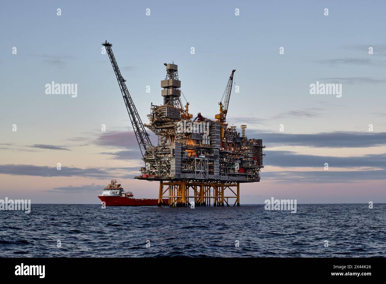 Offshore oil and gas jackup platform, during cargo operations with ...