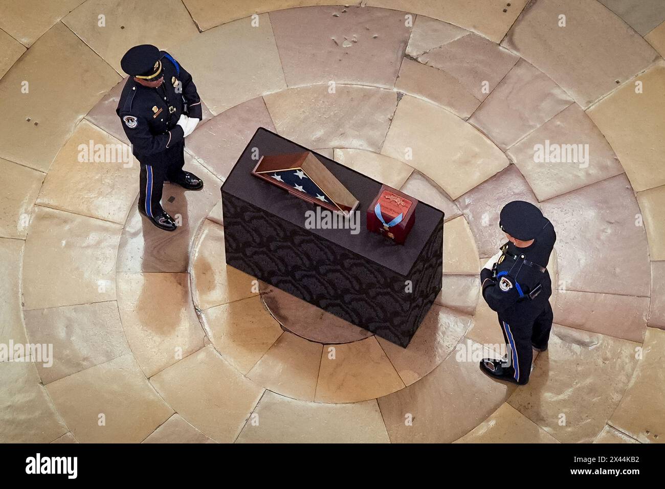 WASHINGTON, DC - APRIL 29: An honor guard stands at an urn containing ...