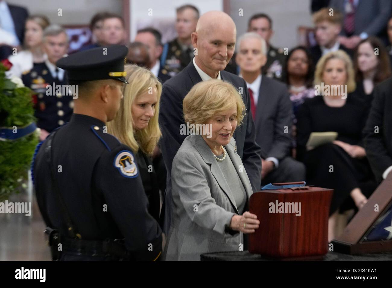 Washington, USA. 29th Apr, 2024. Jean Puckett touches the urn with the ...