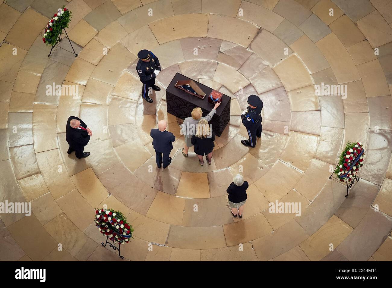 WASHINGTON, DC - APRIL 29: Jeannie Puckett reaches out to touch the urn ...
