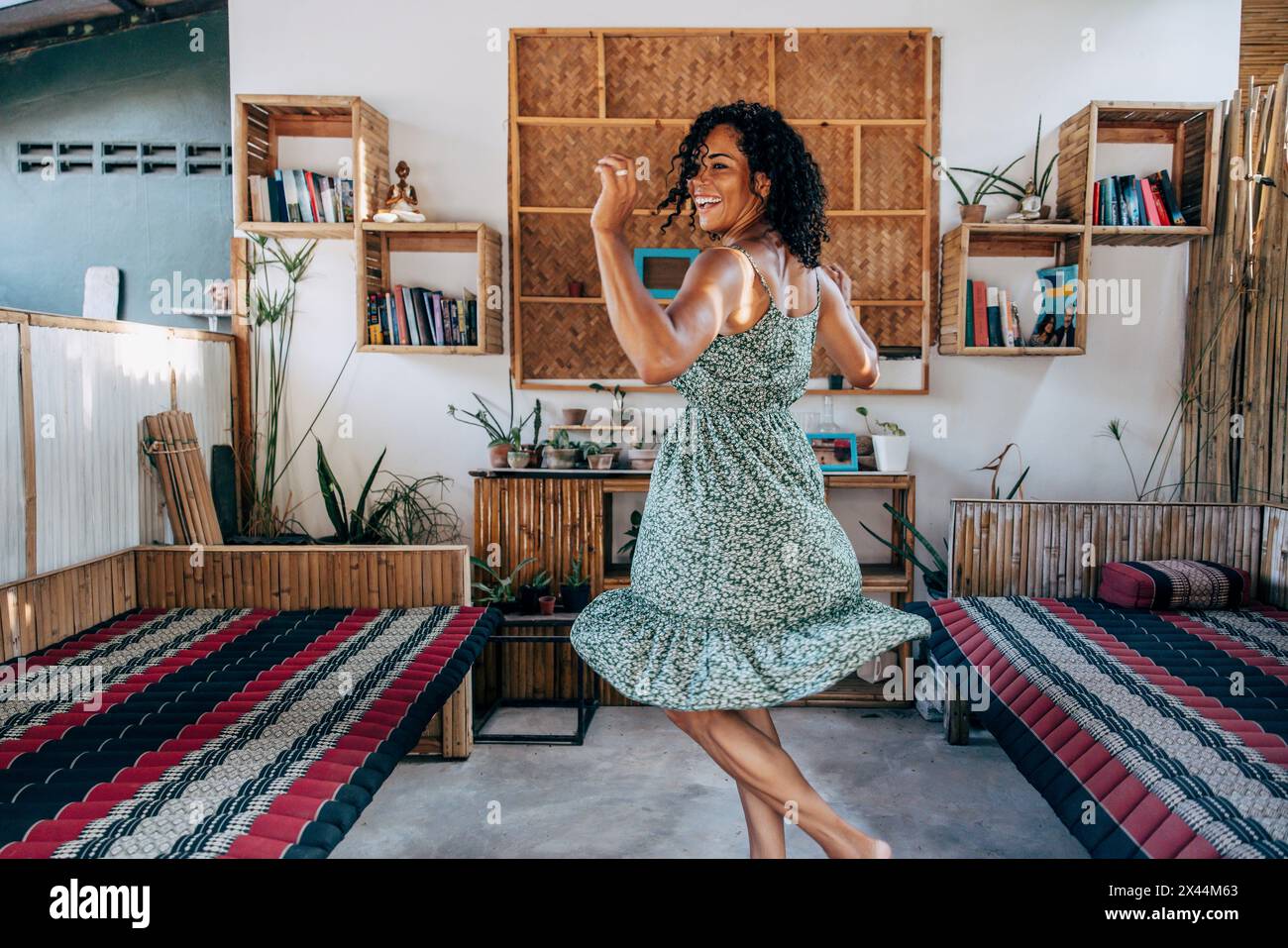 Happy mature woman spinning while dancing at wellness resort Stock ...