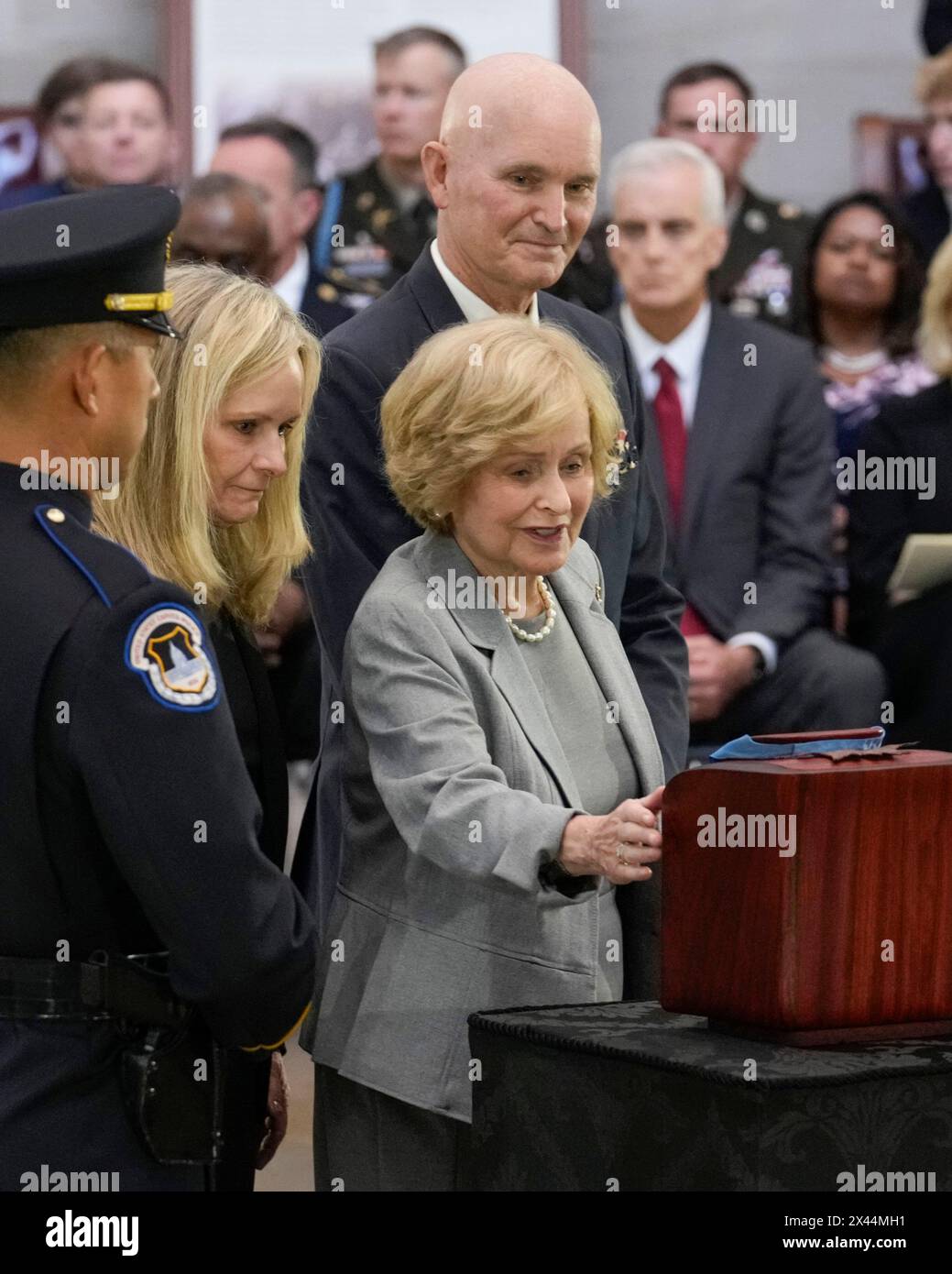 Washington, USA. 29th Apr, 2024. Jean Puckett touches the urn with the ...