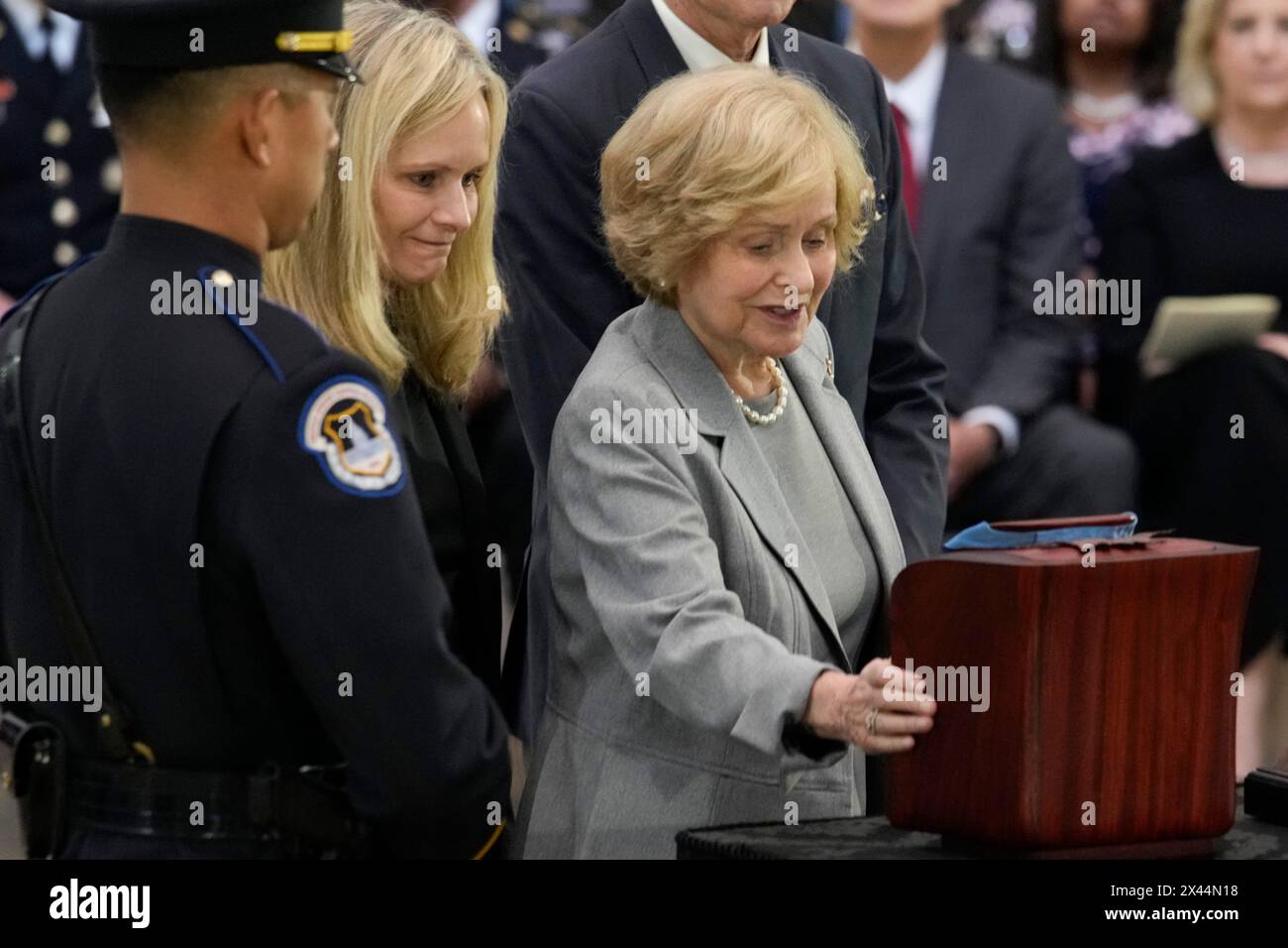 Washington, USA. 29th Apr, 2024. Jean Puckett touches the urn with the ...