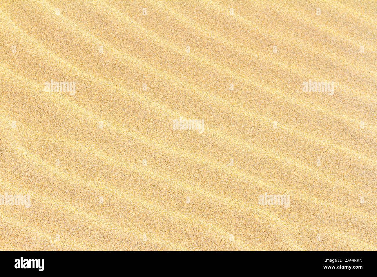Rippled sand on the sea coast formed by wind and water, background ...