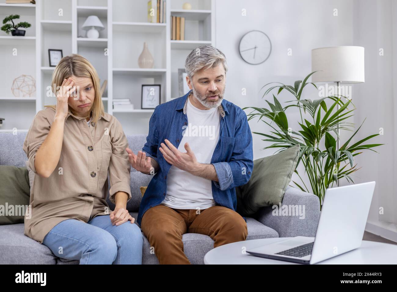 A married couple engages in a serious online consultation with a psychologist about family ...