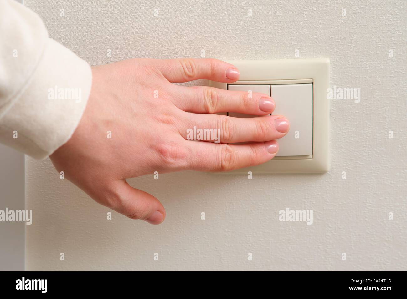 Womans hand light switch hi-res stock photography and images - Alamy