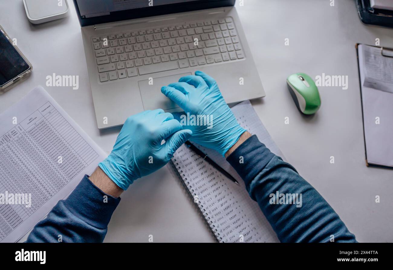 Integration of technology in laboratory research. hands and laptop ...