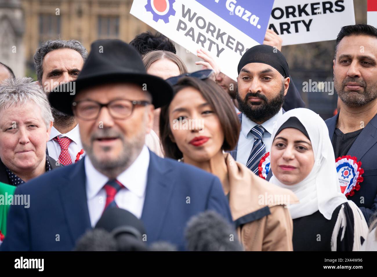 Former England cricketer Monty Panesar (back right) attends a news ...
