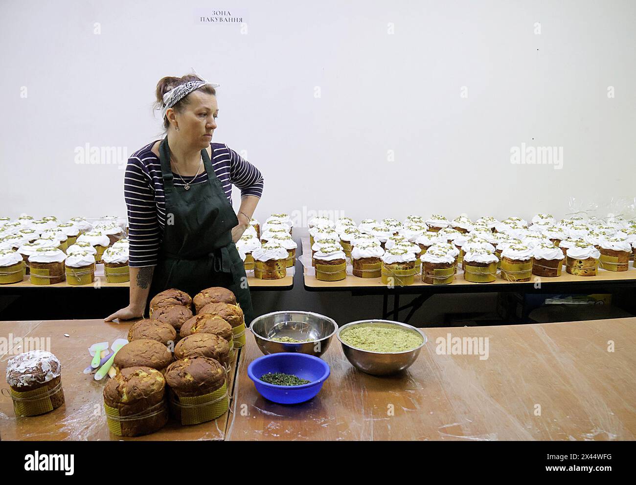 KYIV, UKRAINE - APRIL 29, 2024 - A cook stands by paskas (Ukrainian ...
